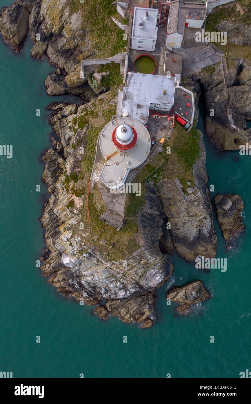 Aerial view of The Baily Lighthouse along the wild coastline near North ...