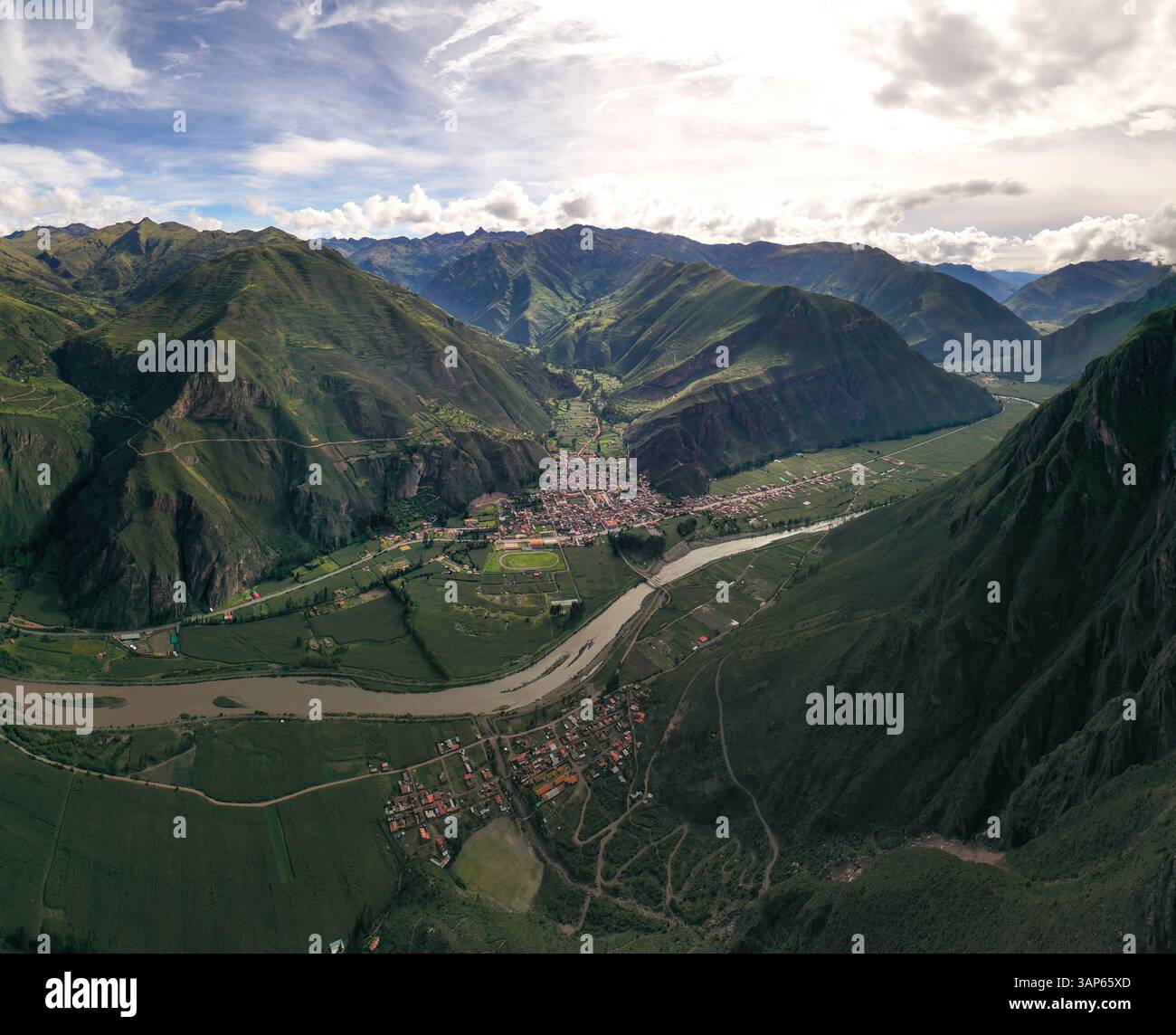 Aerial view of Huchuy Qosqo inca ruins with natural mountain forms ...