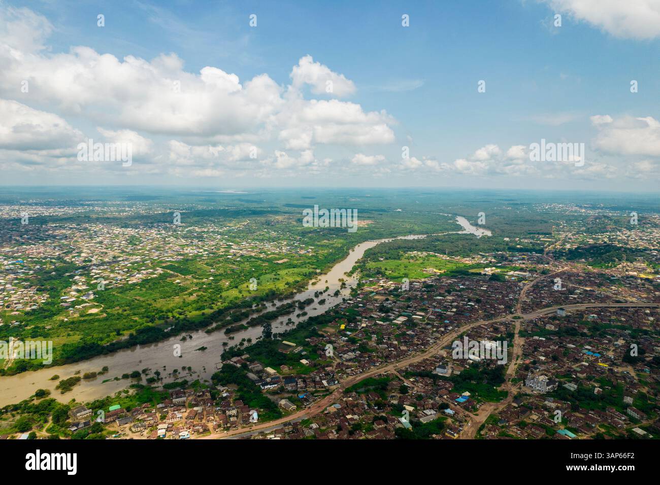 Aerial view of a green, expansive landscape with rooftops and roads, Ogun State, Nigeria Stock ...