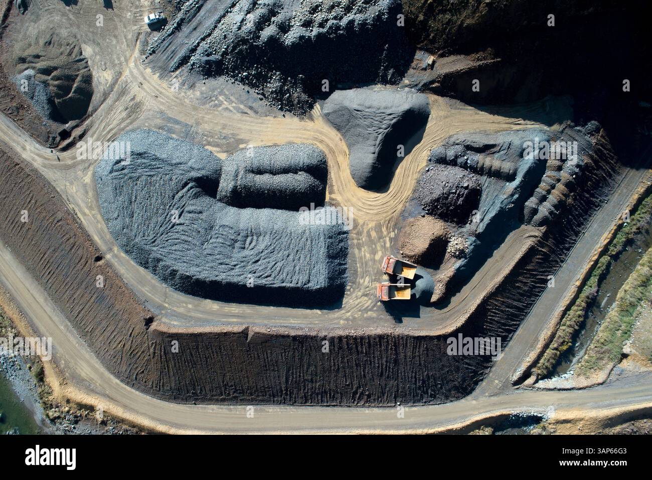 Aerial view of the industrial quarry with heavy machinery and ...