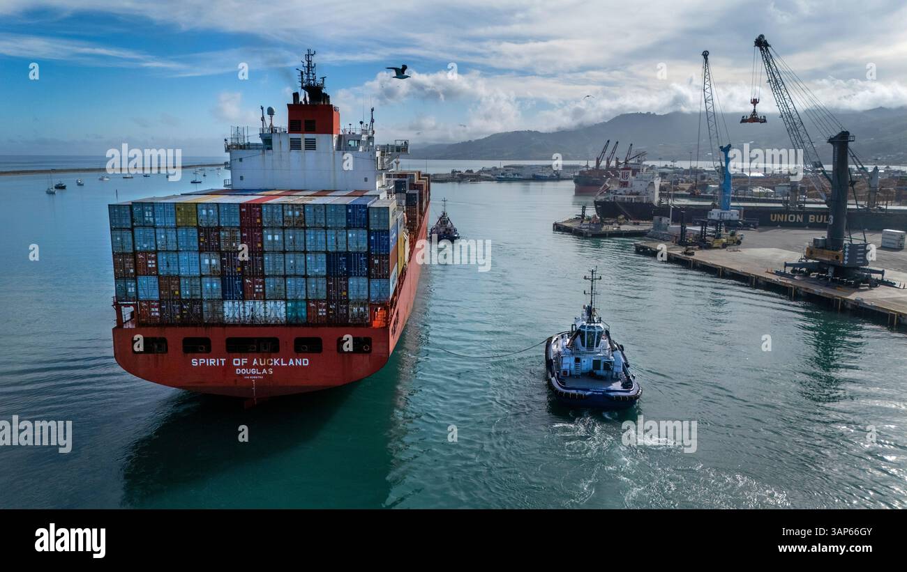 Aerial view of Port Nelson with container ship, tugboat, and cranes ...