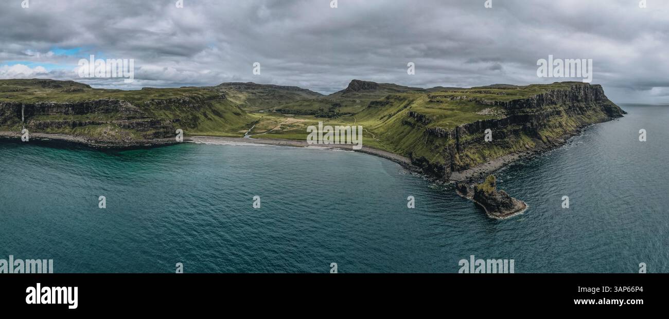 Aerial view of breathtaking cliffs and rugged coastline meeting the ...