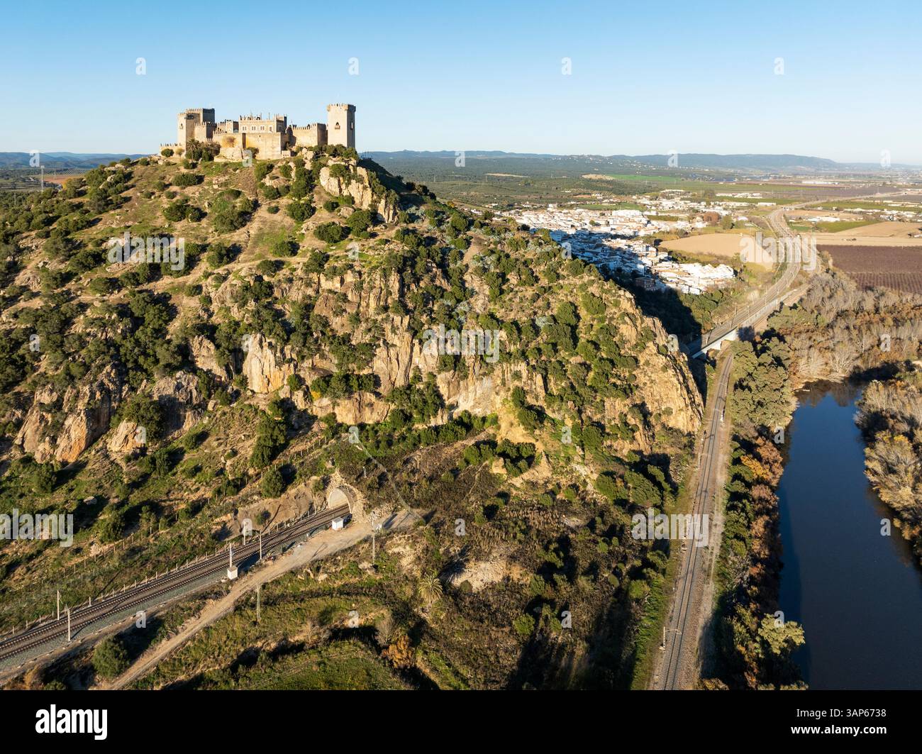 Aerial view of medieval castle on a hill overlooking the river and ...