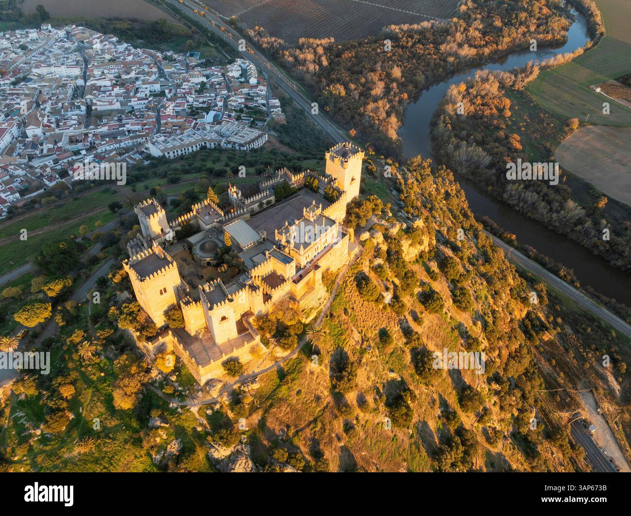 Aerial view of historic medieval castle overlooking scenic village and ...