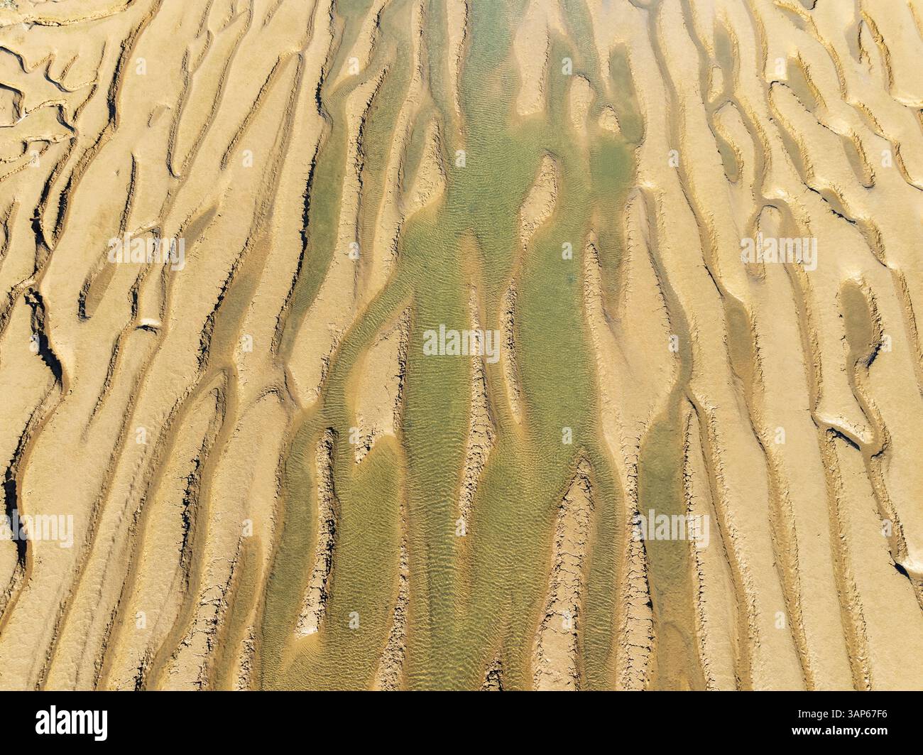 Aerial view of serene patterns and textures of sand along the Odiel ...