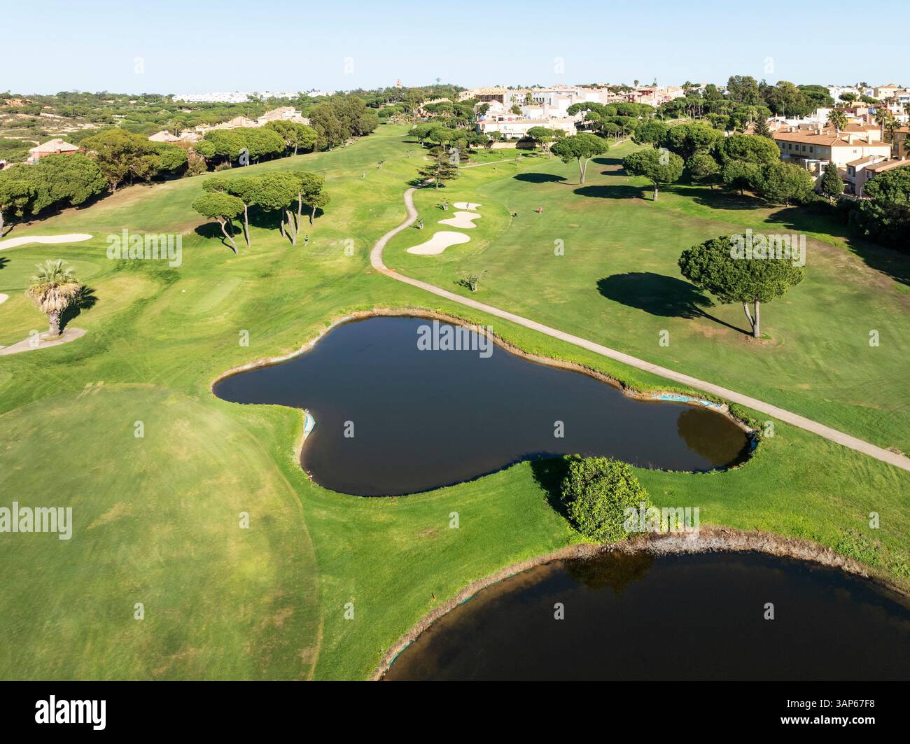 Aerial view of Islantilla Golf Resort with beautiful green fairways ...