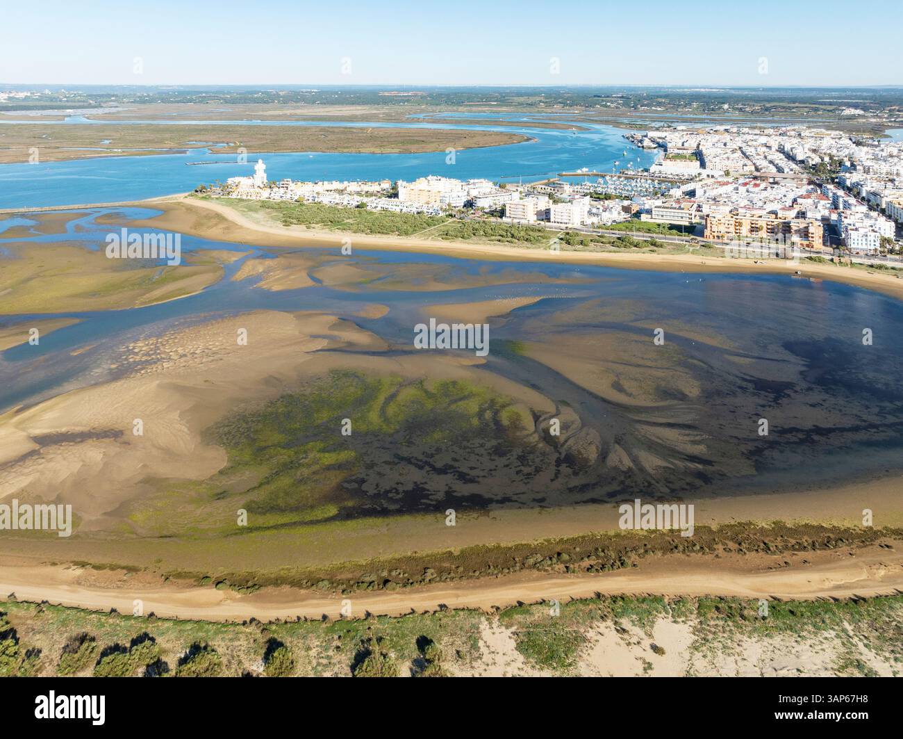 Aerial view of beautiful wetlands and coastline with a river and urban ...