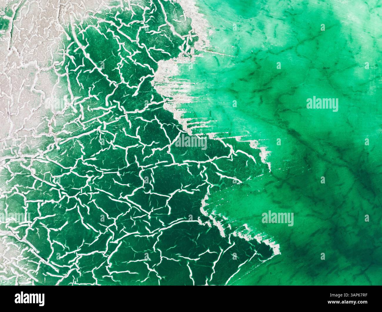 Aerial view of industrial waste pond with abstract patterns and ...