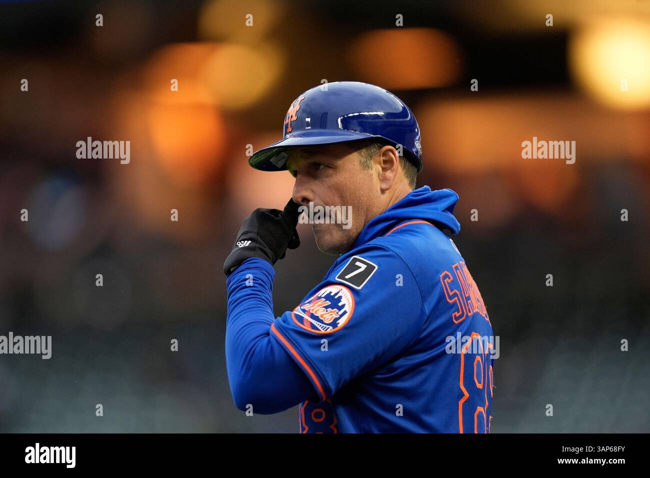 New York Mets third base coach Mike Sarbaugh (88) stands on the field ...
