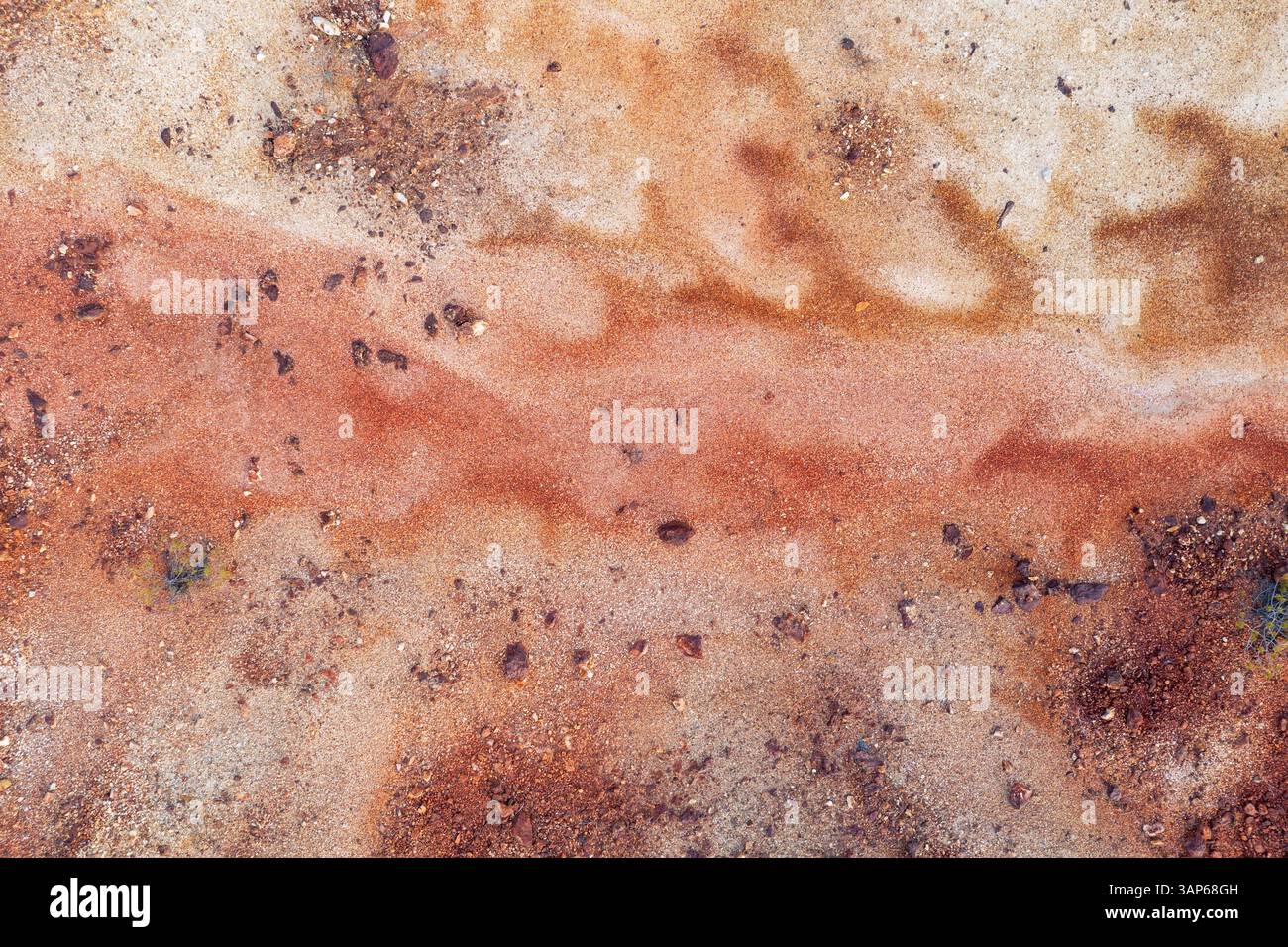 Aerial view of the unique and abstract patterns of Rio Tinto with its reddish-brown sediment and ...