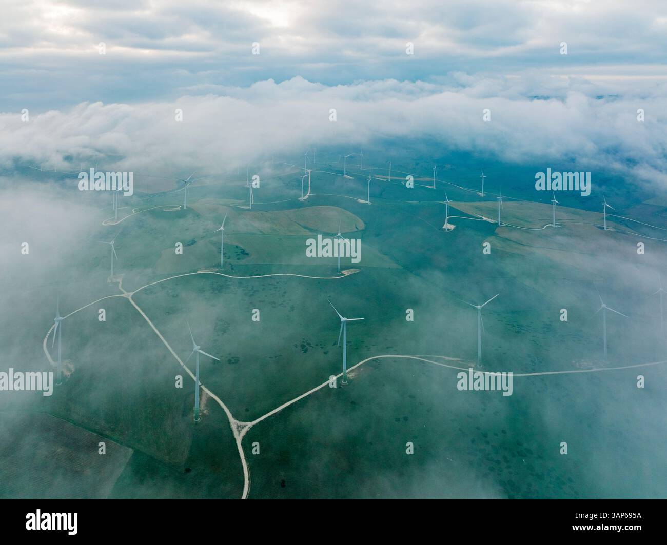 Aerial view of Windmills on a wind farm. In the background Zahara de ...
