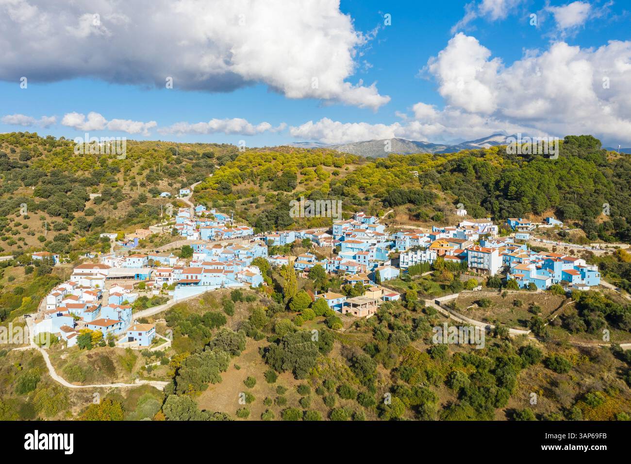 Aerial view of The village of Júzcar above the Genal river valley ...