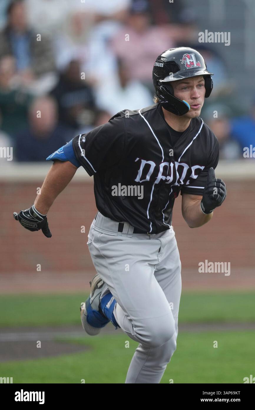 Maxton Martin (41) of the Hickory Crawdads runs out a batted ball in a ...