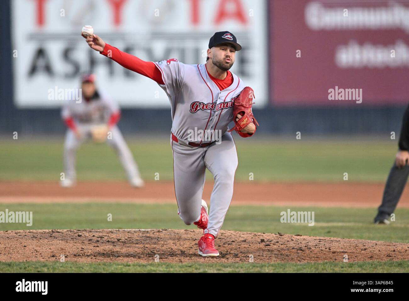 Greenville Drive pitcher Cooper Adams (25) delivers a pitch during a ...