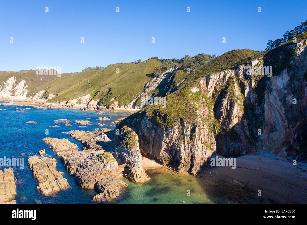 Aerial view of the sea and cliffs at El Oso Beach and La Franca Beach ...