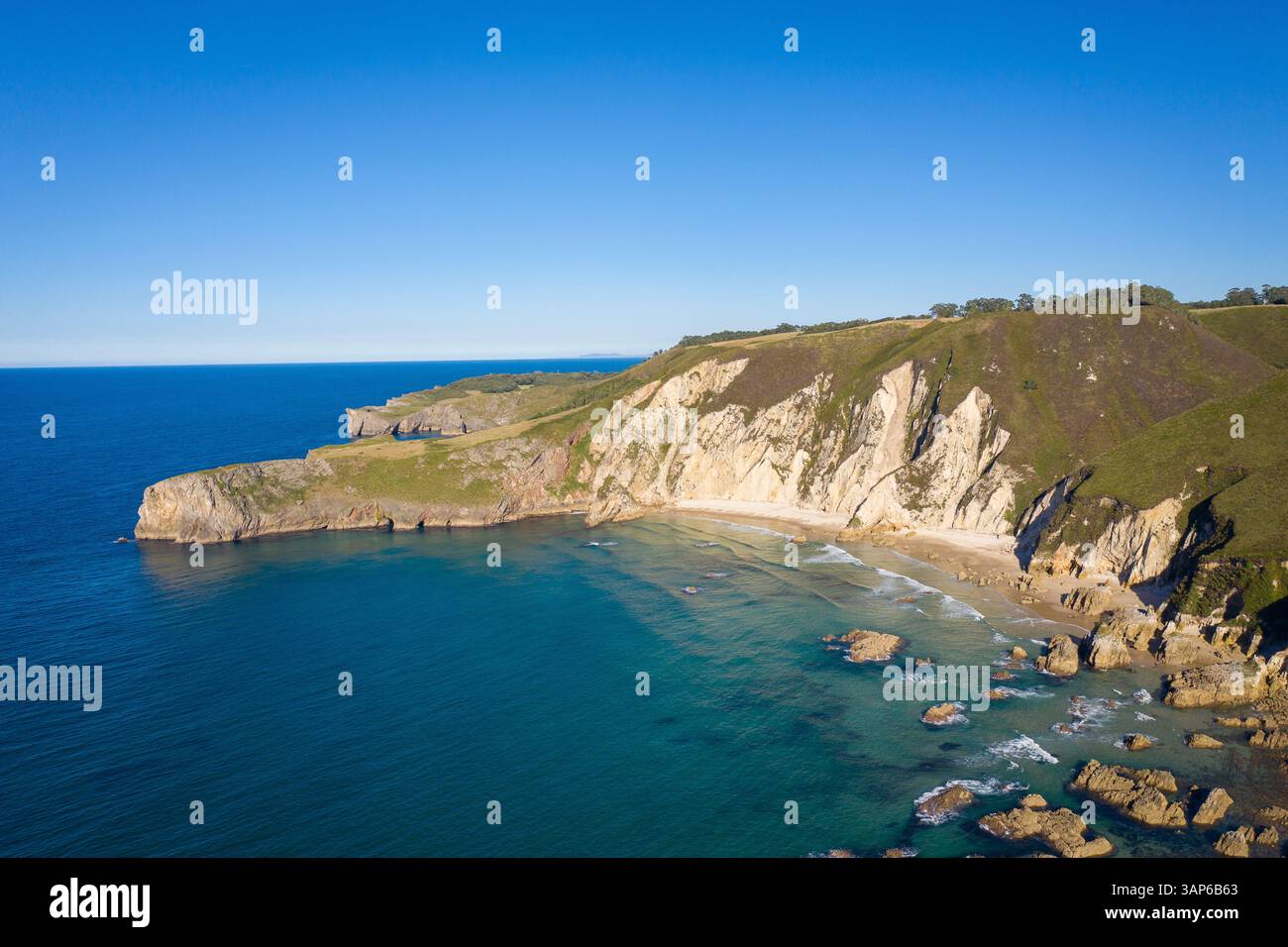 Aerial view of the sea and cliffs at El Oso Beach and La Franca Beach ...