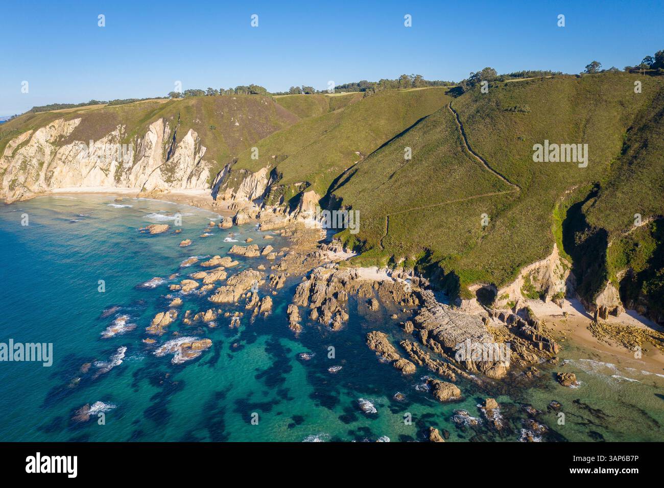 Aerial view of the sea and cliffs at El Oso Beach and La Franca Beach ...