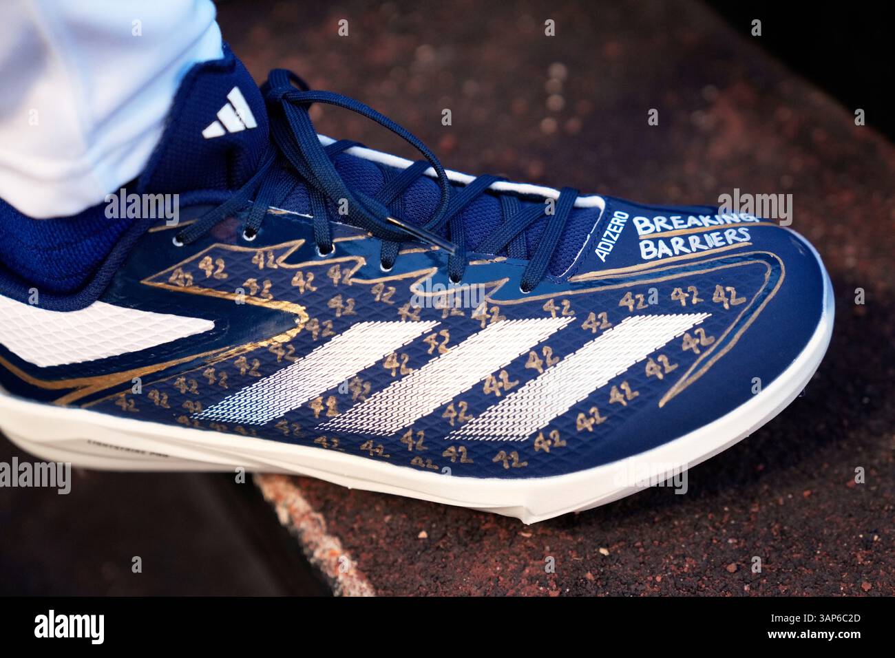 St. Louis Cardinals' Victor Scott II wears number 42 on his cleats to ...