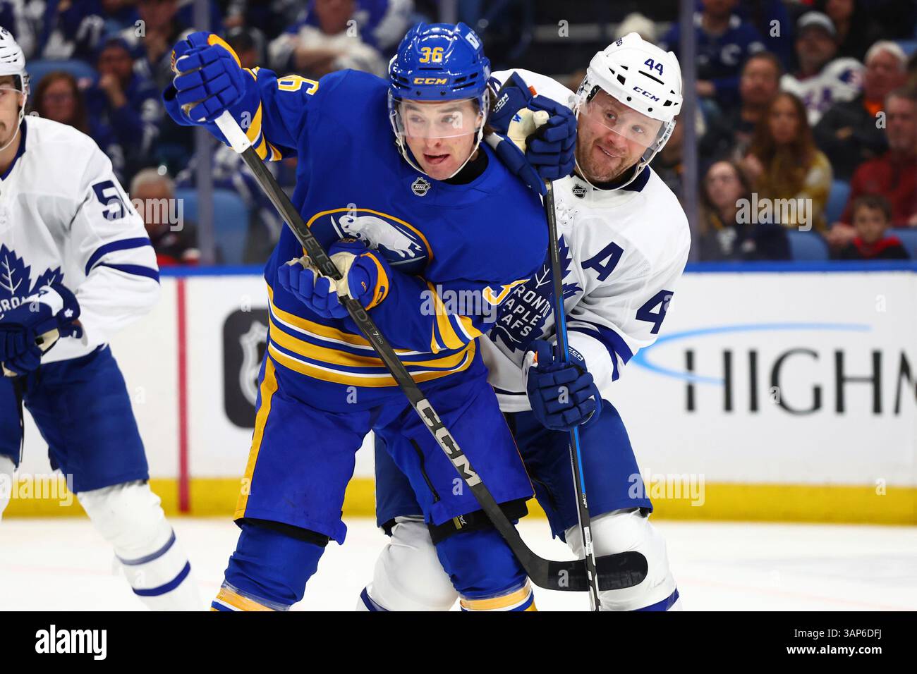Buffalo Sabres center Noah Ostlund (36) is checked from behind by ...