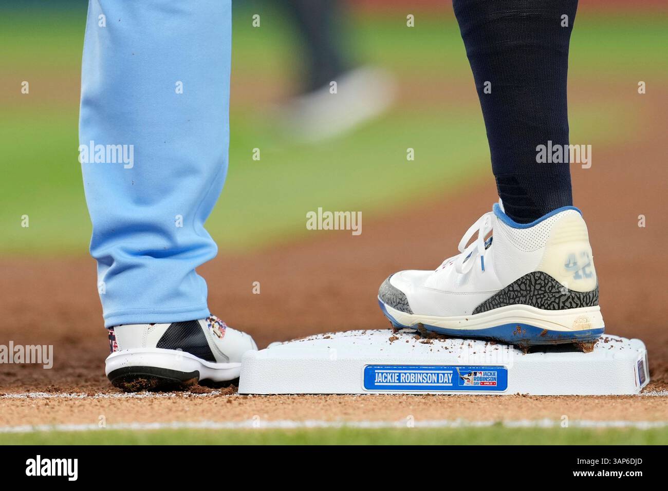 New York Yankees' Aaron Judge, right, wears cleats with the number 42 ...