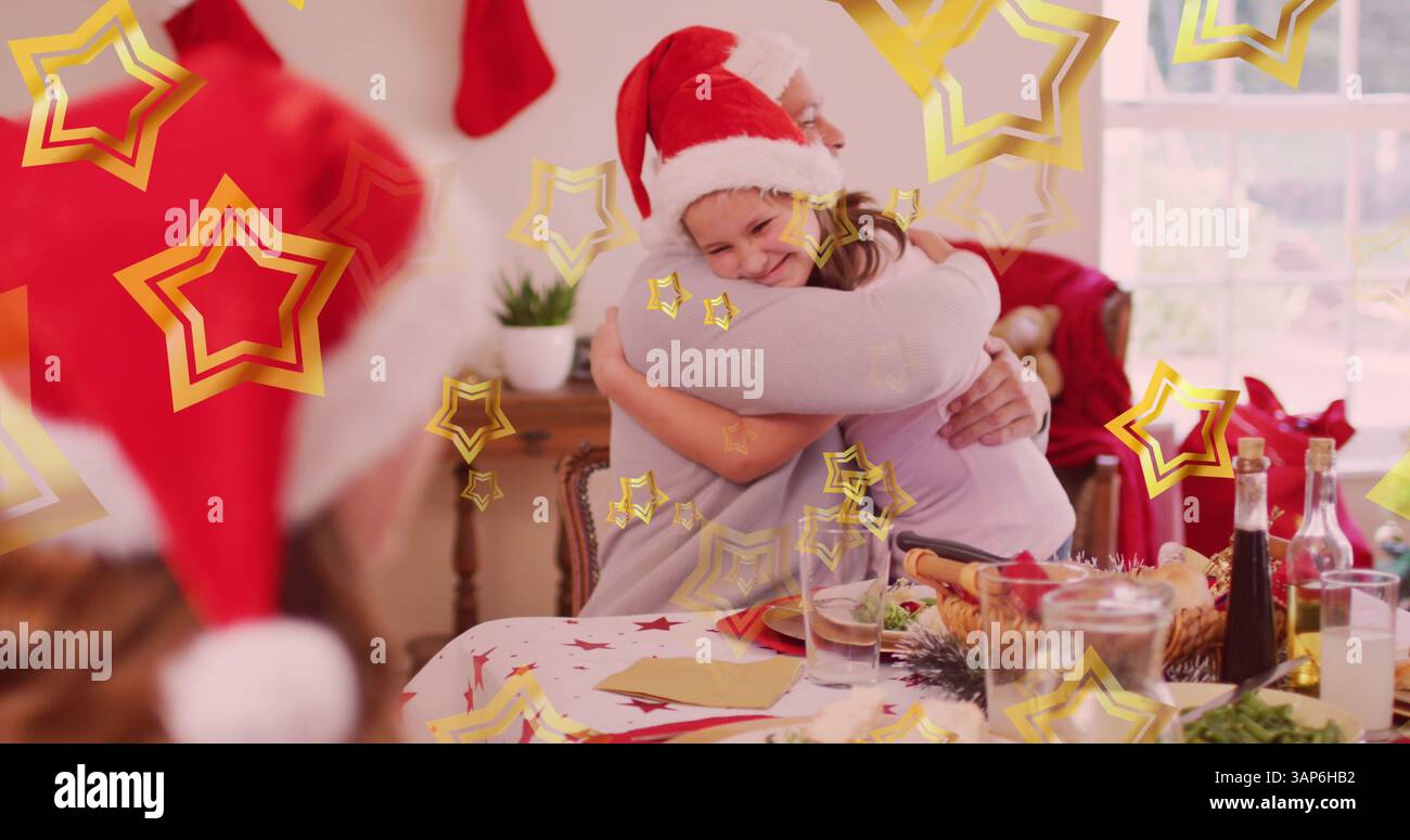 Image of stars floating over happy caucasian family wearing santa hats ...