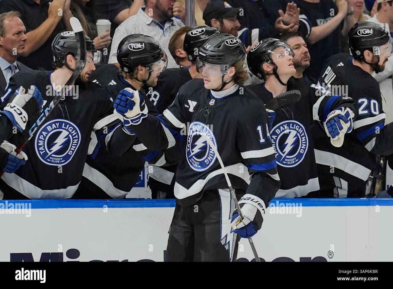 Tampa Bay Lightning center Conor Geekie (14) celebrates with the bench ...