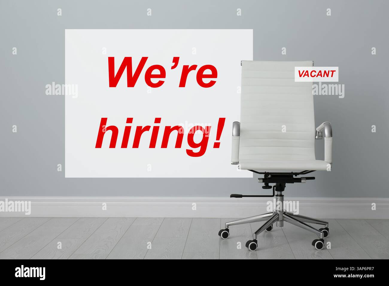 We're hiring. Empty office chair with word Vacant in room. Recruitment ...