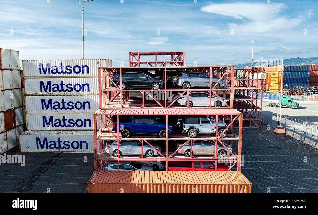 Vehicles line a shipping terminal at the Port of Oakland on Tuesday ...