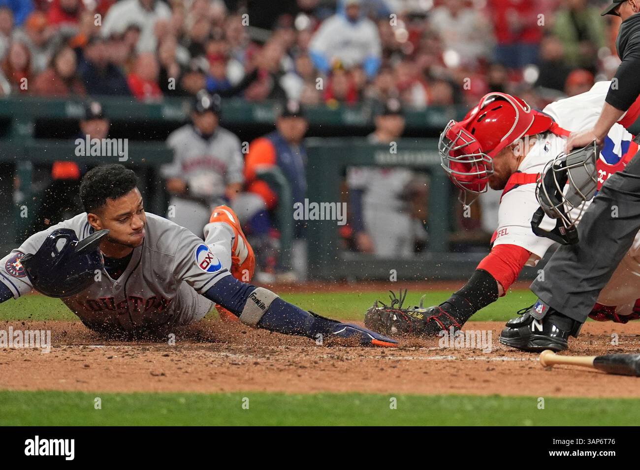 Houston Astros' Jeremy Pena, left, scores past St. Louis Cardinals ...