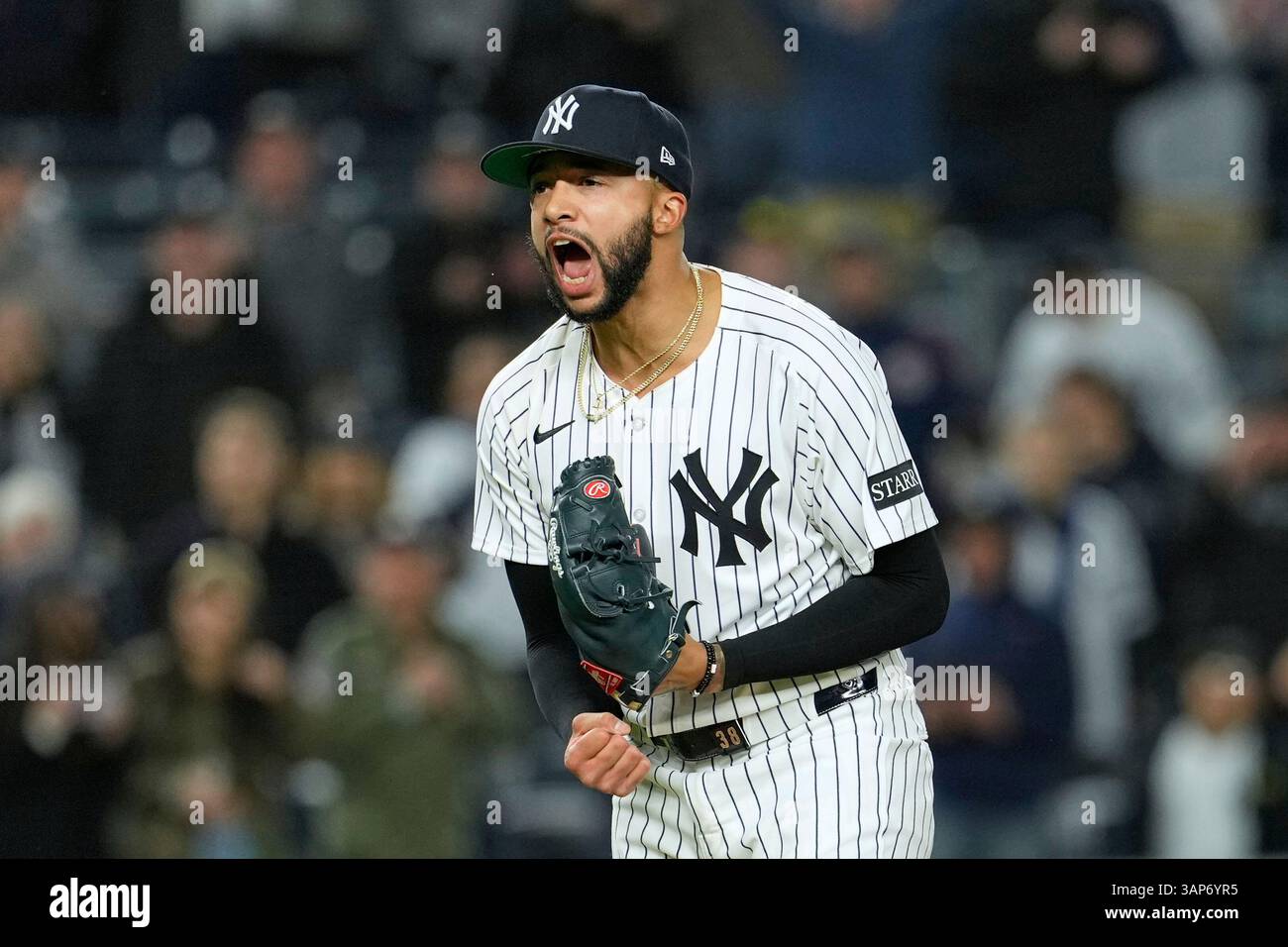 New York Yankees pitcher Devin Williams reacts after the last out of a ...