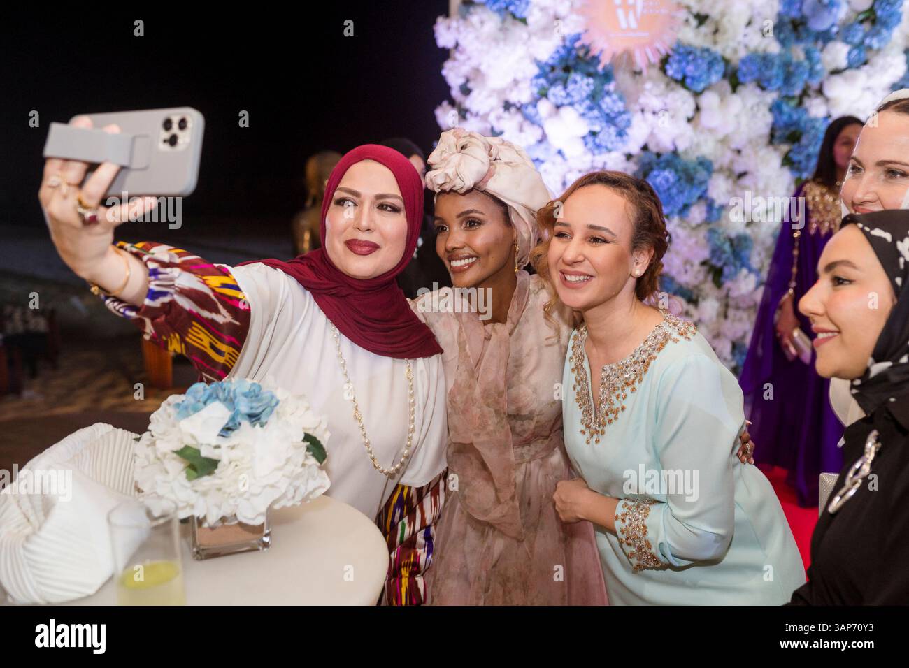 Abu Dhabi, United Arab Emirates. 13th Apr, 2025. Halima Aden (C-L ...