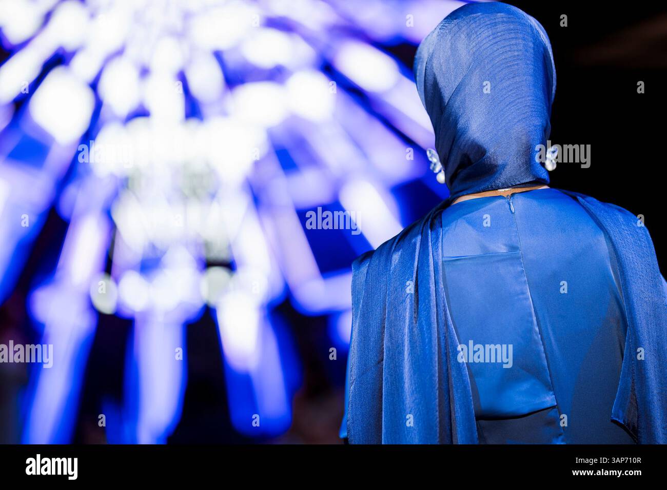 Abu Dhabi, United Arab Emirates. 13th Apr, 2025. A woman wearing ...