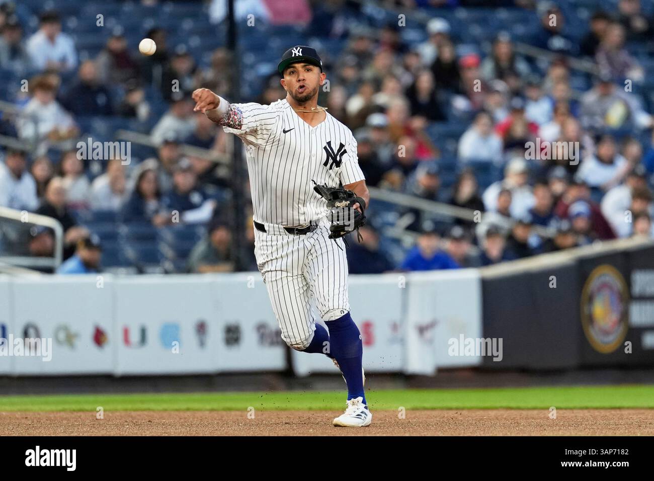 New York Yankees third baseman Oswald Peraza throws to first base ...