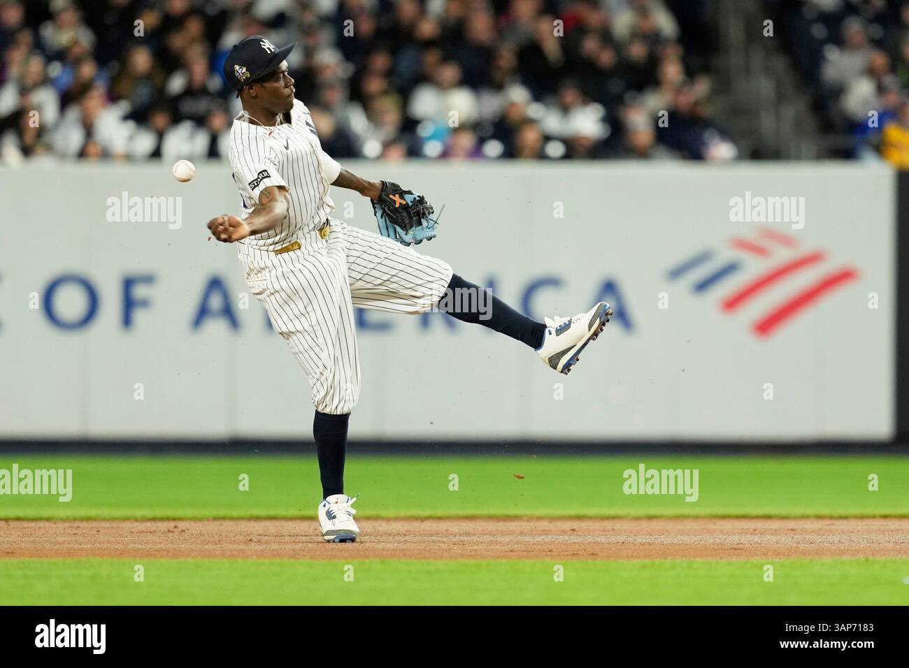 New York Yankees second baseman Jazz Chisholm Jr. throws to first base during the fifth inning ...