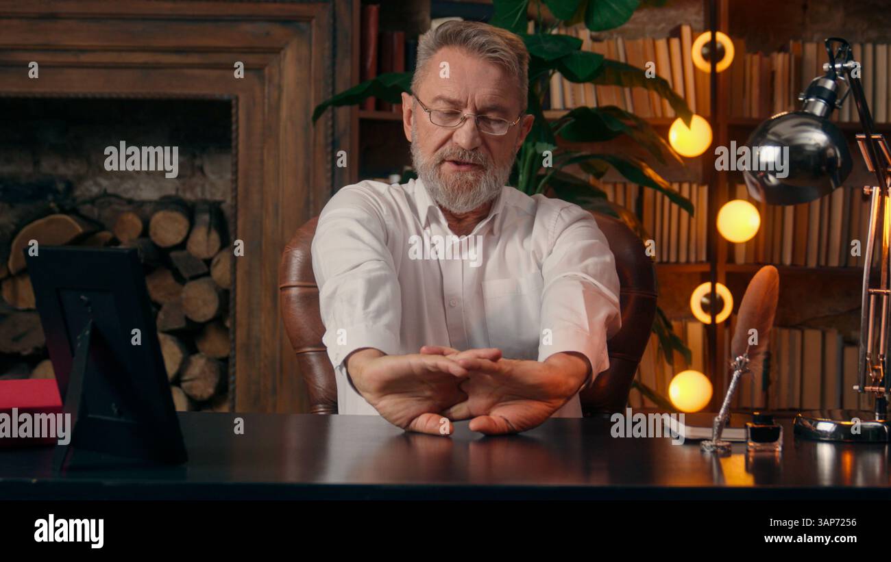Old Caucasian man mature elderly male stretching hands arms yawning ...