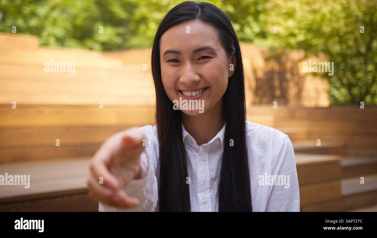 Asian Korean Japanese woman extend hand greeting smiling friendly ...