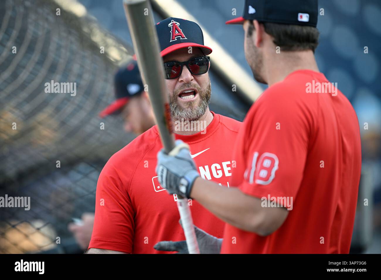 Los Angeles Angels assistant coach Jayson Nix, center, talks with Nolan ...