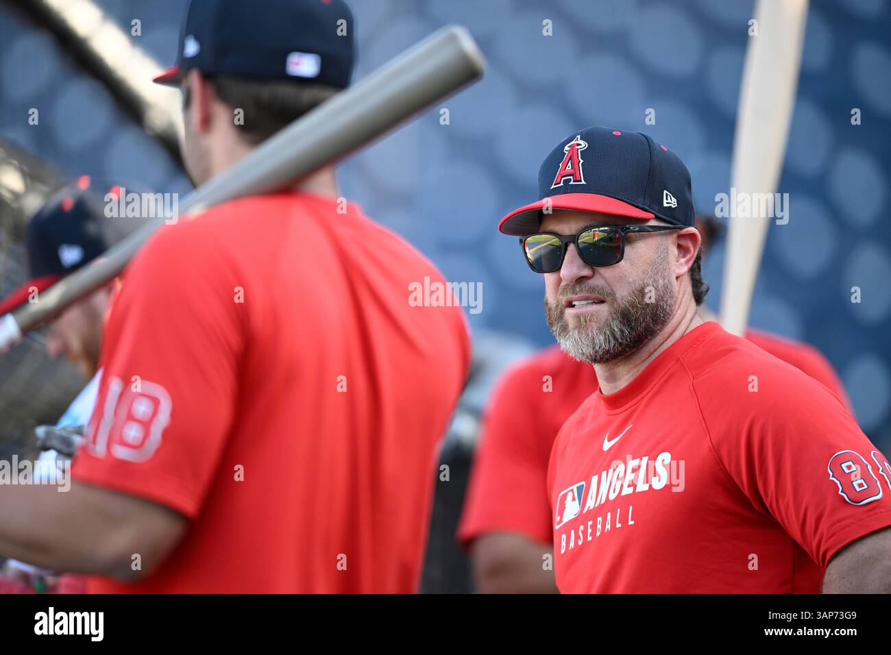 Los Angeles Angels assistant coach Jayson Nix, right, talks with Nolan ...