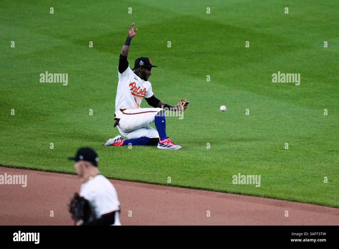 Baltimore Orioles second baseman Jorge Mateo is unable to stop a single ...