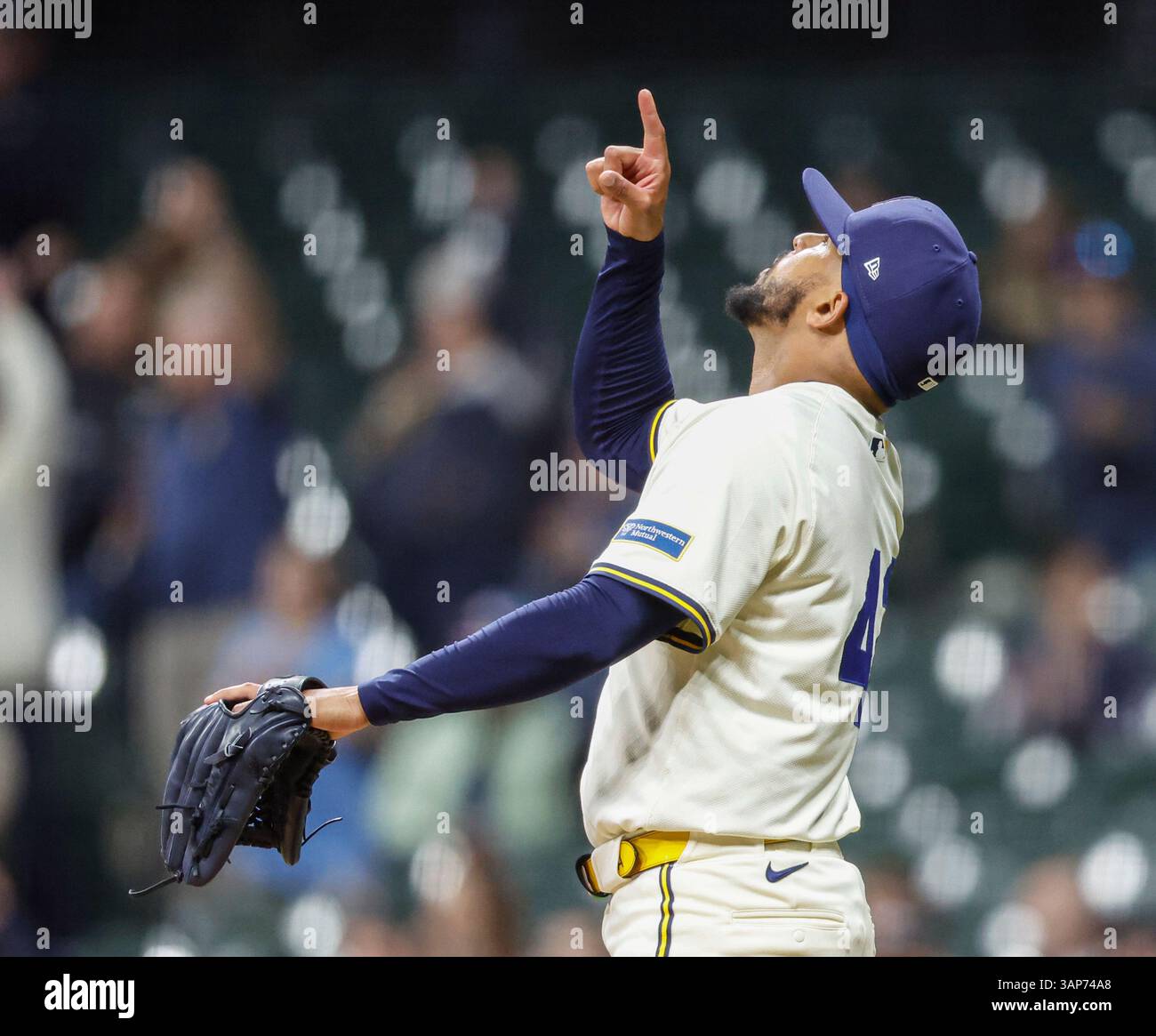 Milwaukee Brewers pitcher Grant Anderson reacts to the last out against ...
