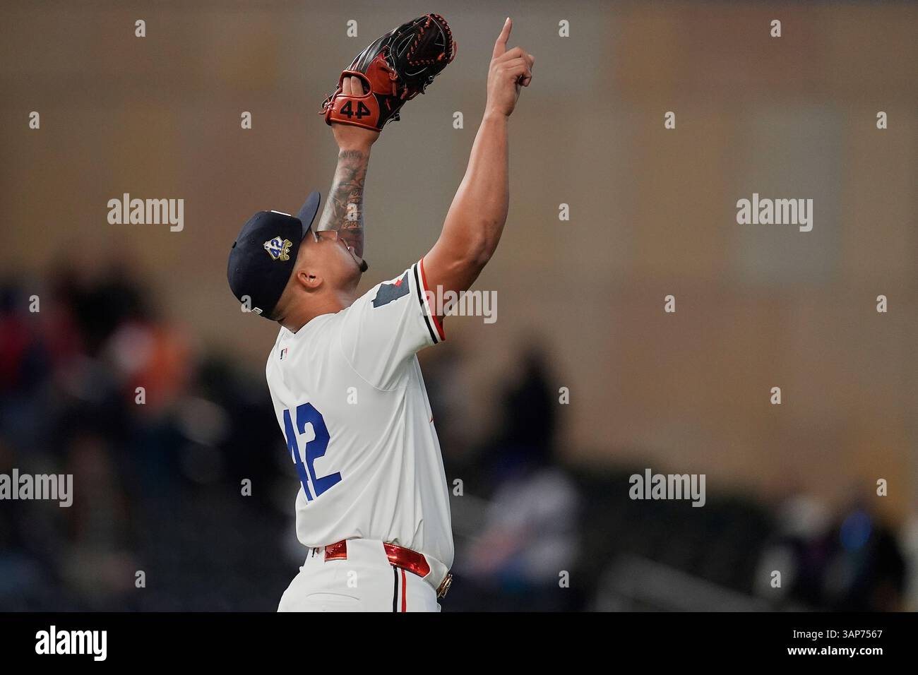 Minnesota Twins relief pitcher Jhoan Duran (59) points after the win of ...