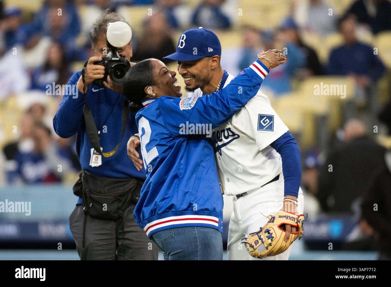 Sonya Robinson Pankey, center, granddaughter of Jackie Robinson, hugs ...