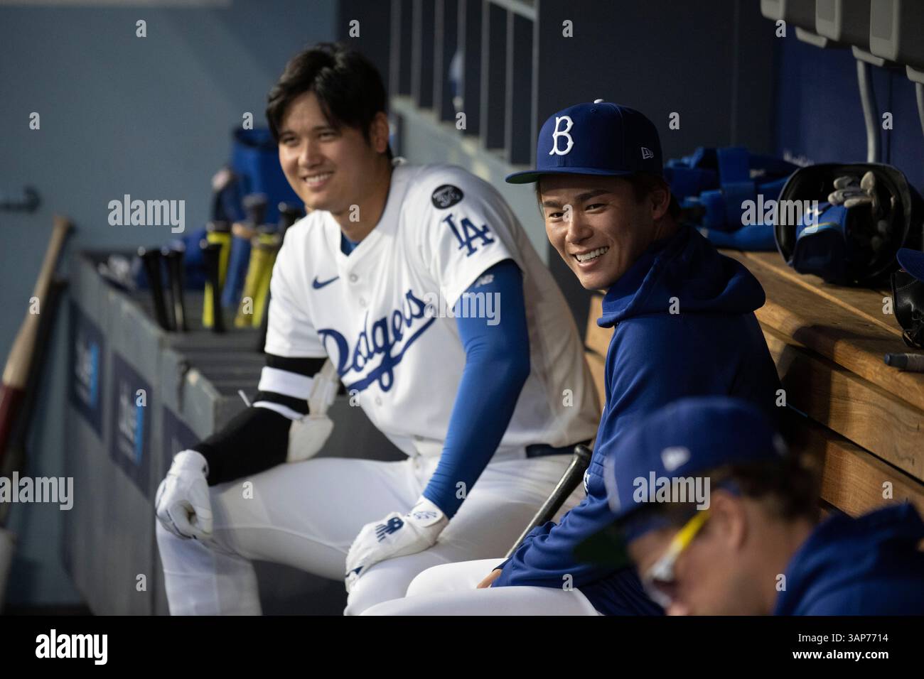 Los Angeles Dodgers' Yoshinobu Yamamoto, right, and Shohei Ohtani smile ...