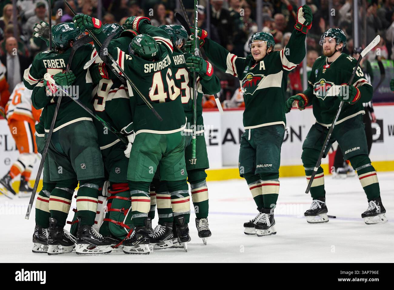 Minnesota Wild players celebrate their teams overtime win against the ...