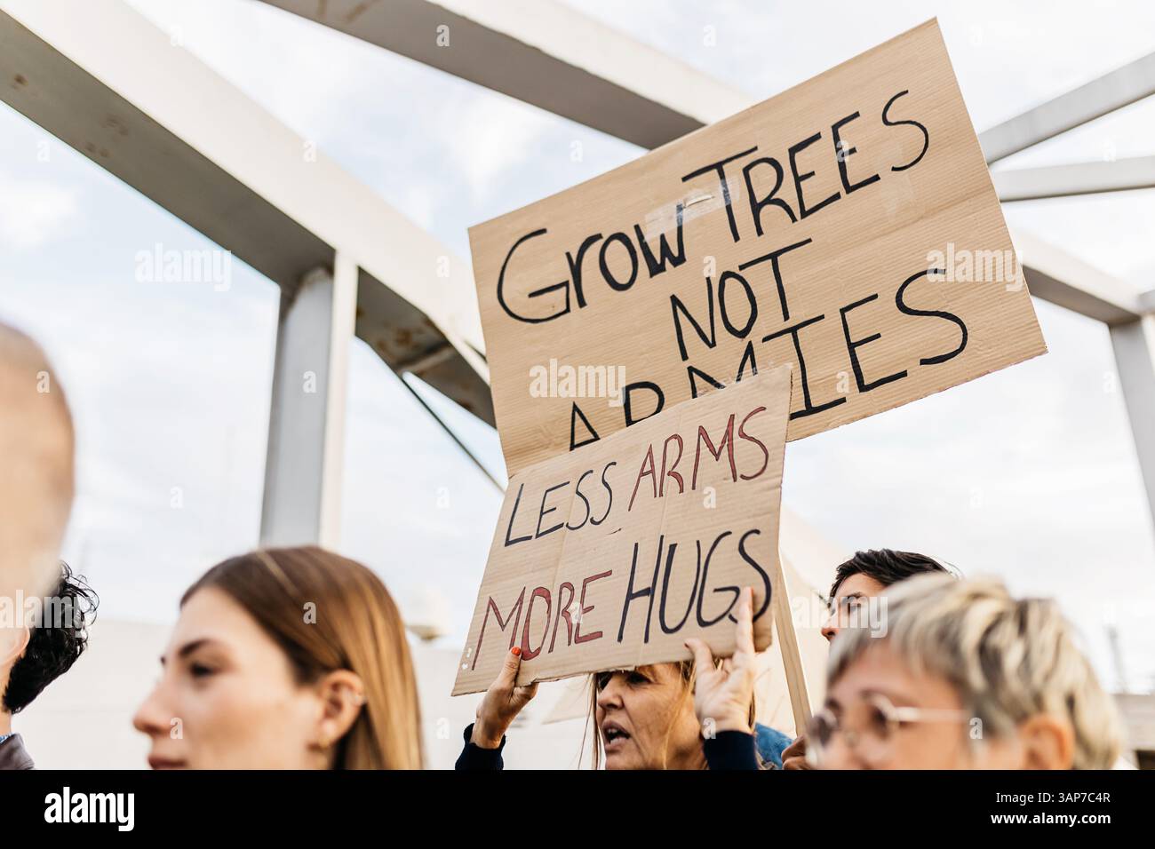 Group of activist people marching for world peace Stock Photo - Alamy