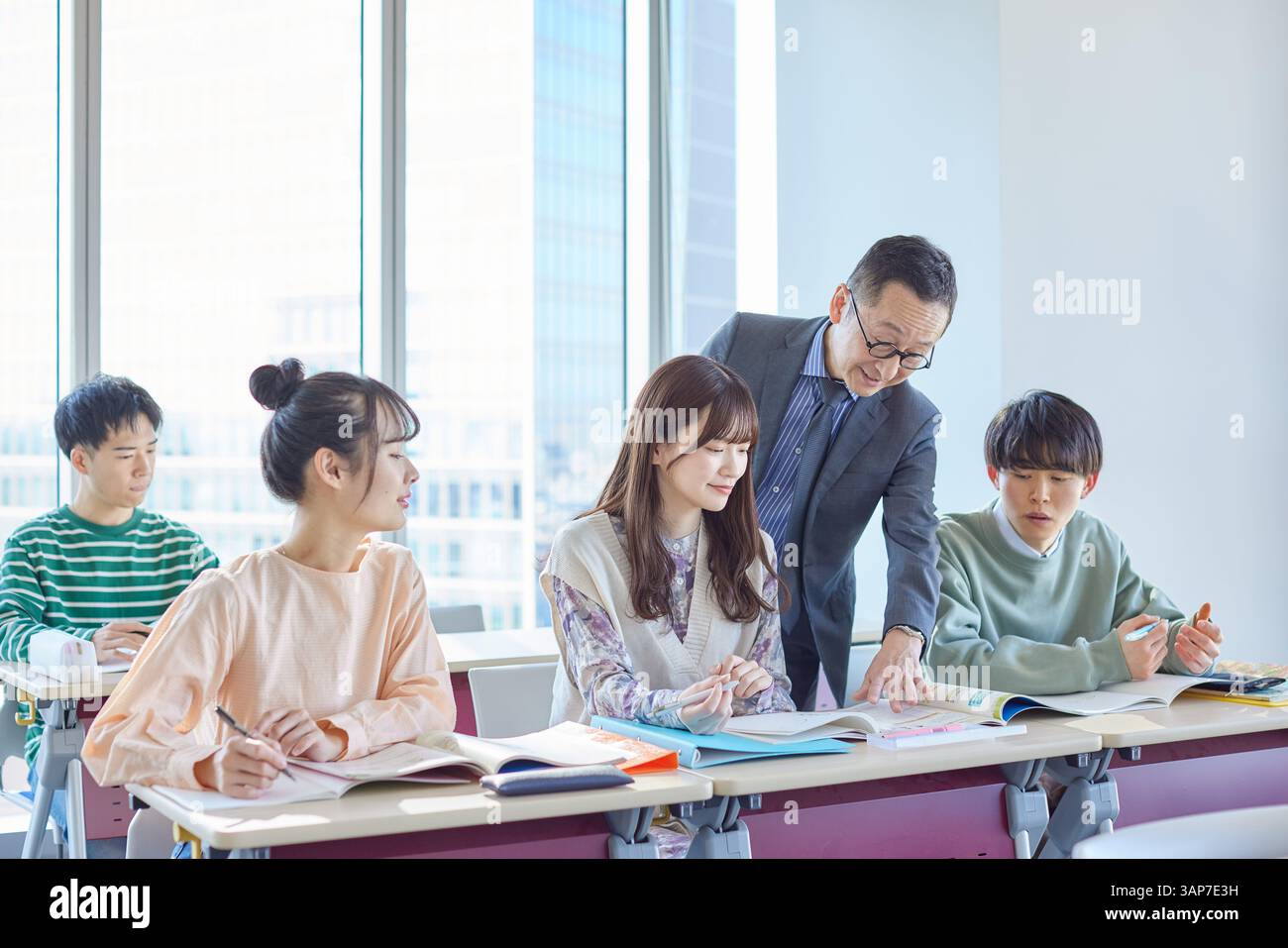 Senior professor watching student hi-res stock photography and images ...