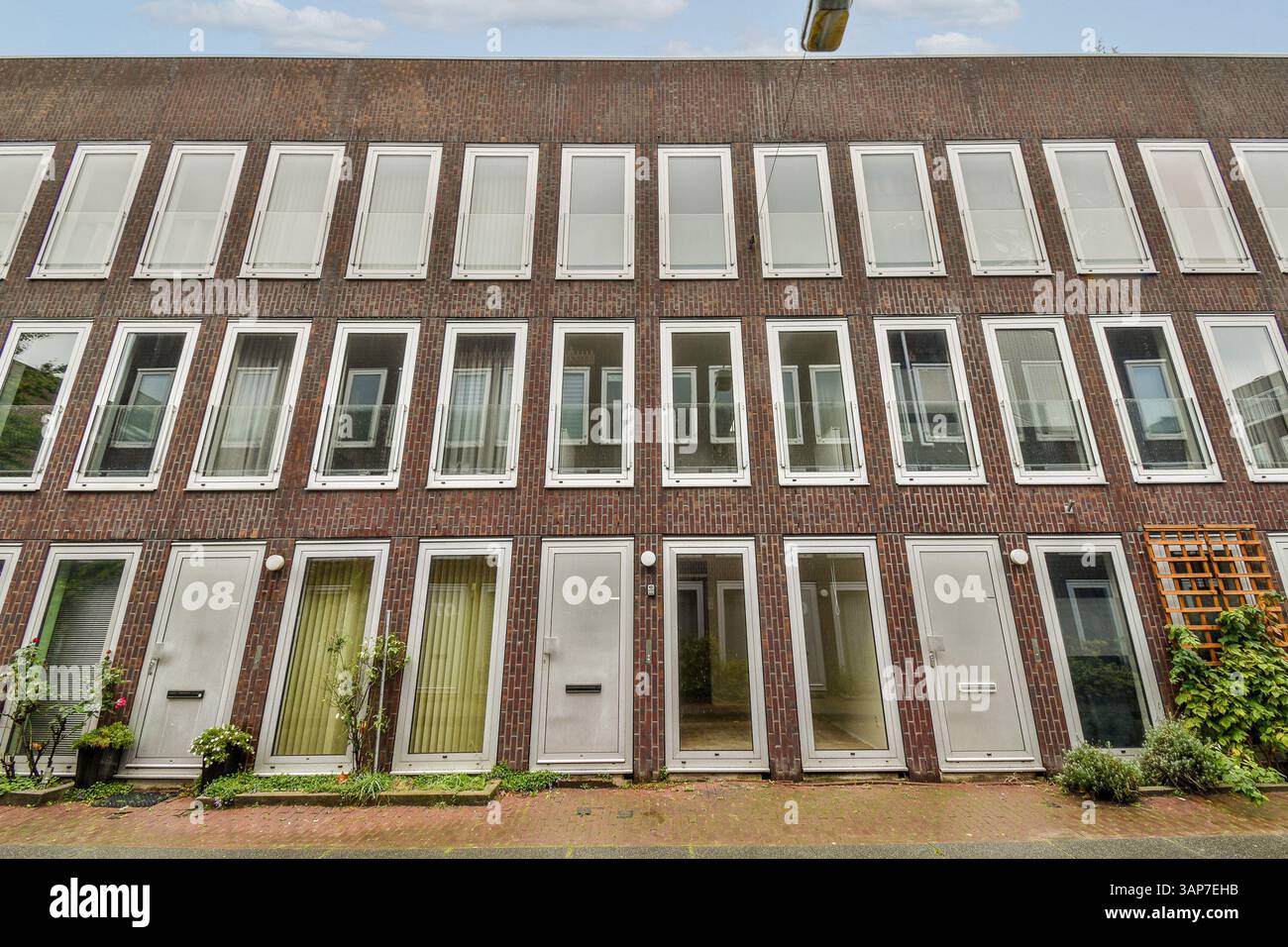 An impressive view of modern row houses showcasing large windows and a ...