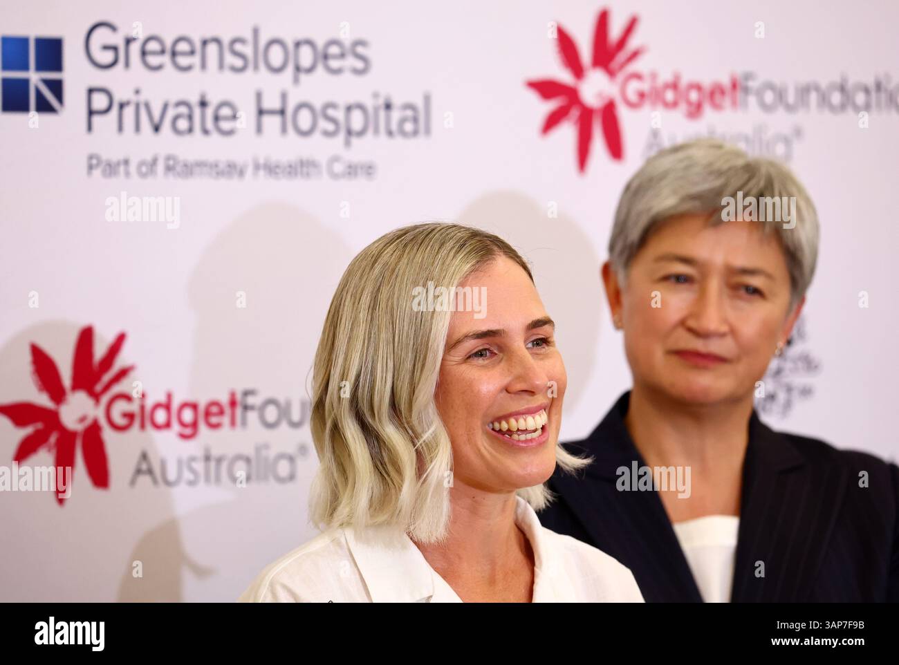 Labor s candidate for Griffith Renee Coffey and Foreign Minister Penny Wong during a visit to ...