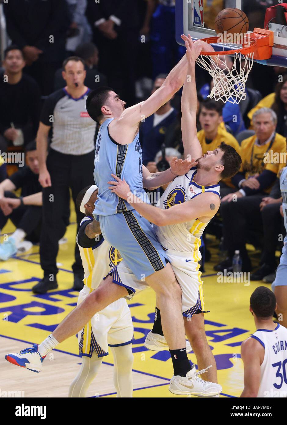 Golden State Warriors' Quinten Post, right, stops a dunk attempt by ...