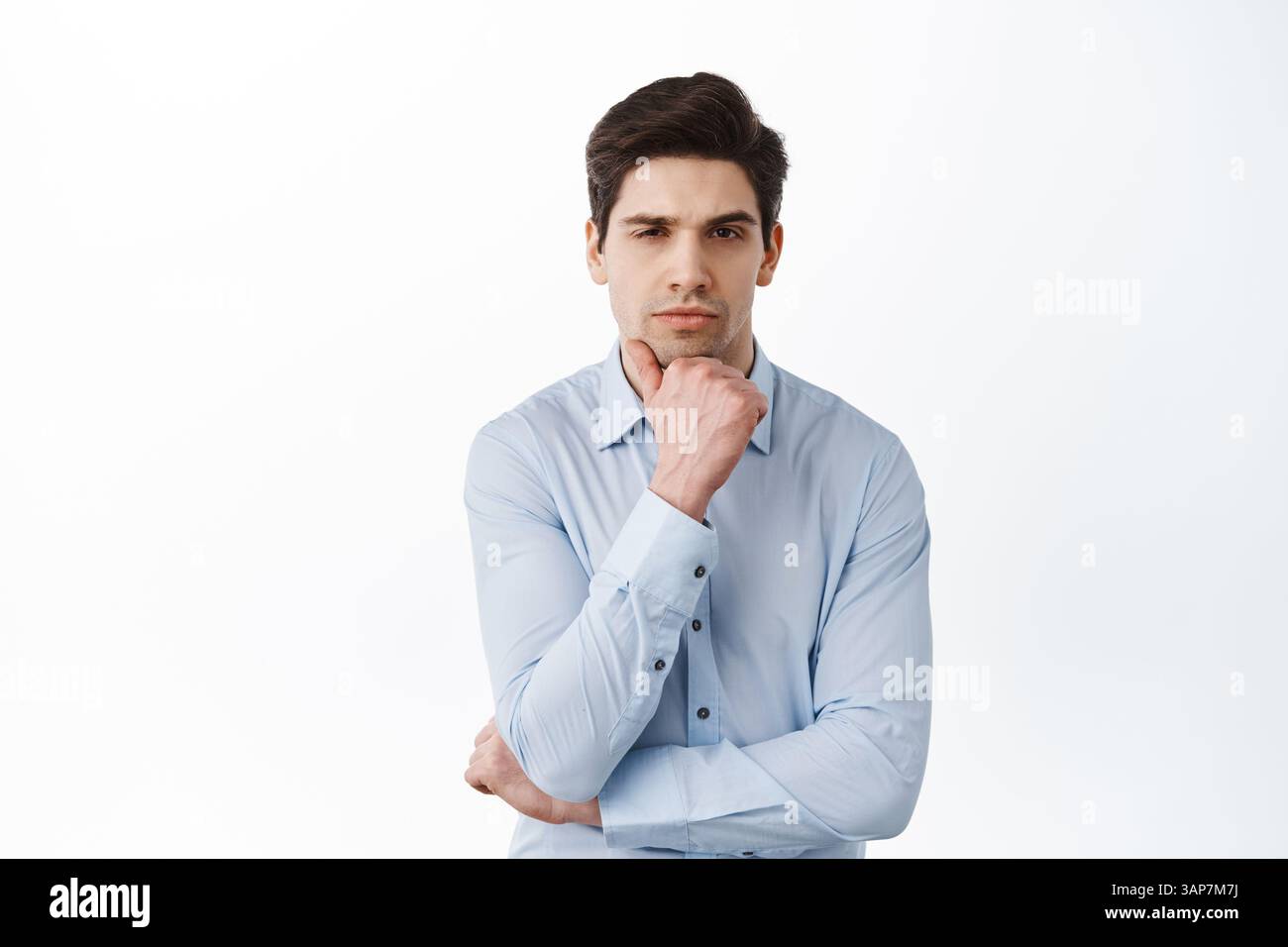 Serious businessman brainstorm, look at camera and think, standing ...